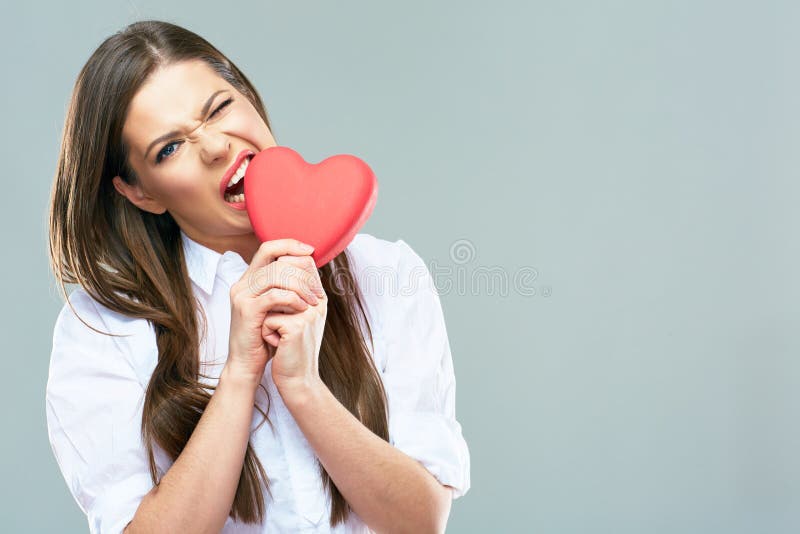 Beautiful Woman Bite Heart. Isolated Portrait Stock Photo - Image of ...