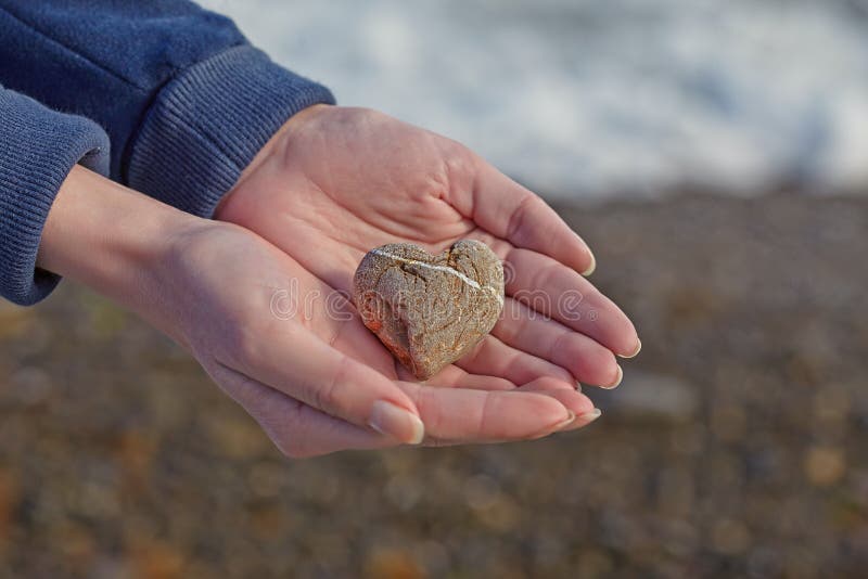 Hearth Shaped Stone in a Womans Hands Stock Image - Image of fingernail ...
