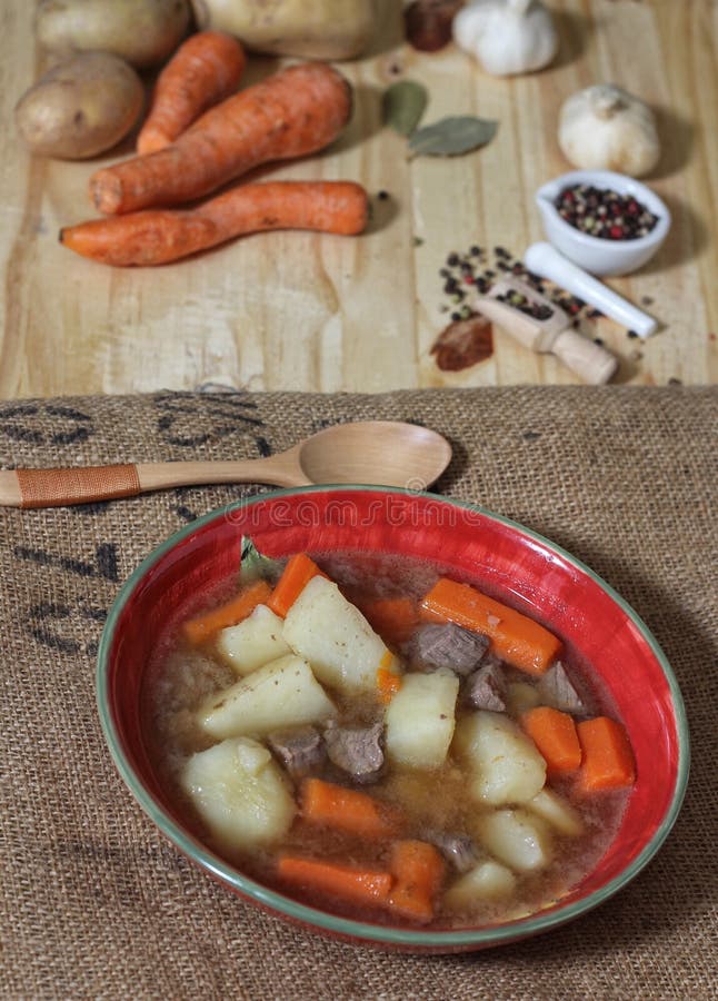 Hearty Beef Stew with Potato and and Carrots on Vintage Burlap Potato ...