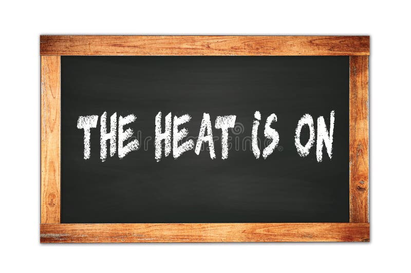 The HEAT is on Text Written on Wooden Frame School Blackboard Stock ...