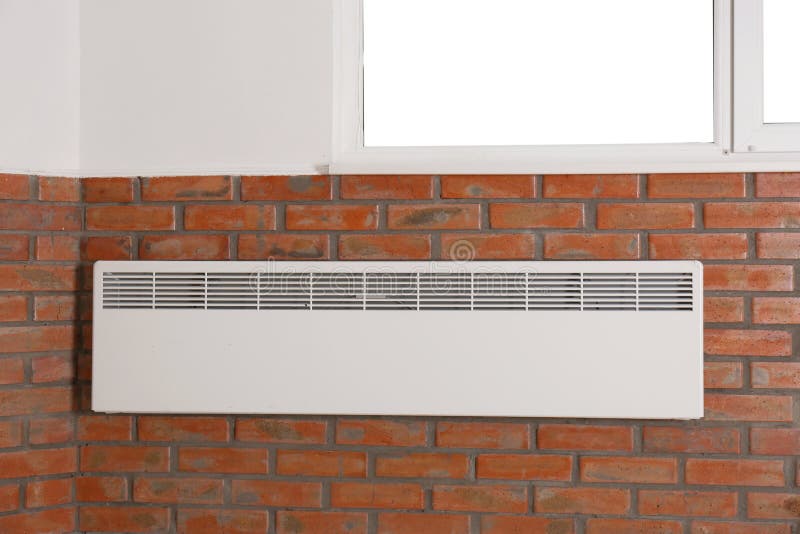 Heating con on brick wall stock photo. Image of temperature - 127821002