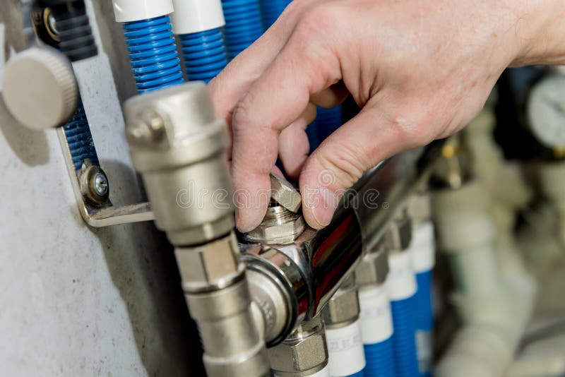 Heating Engineer Fixing Modern Heating System in Boiler Room. Stock ...