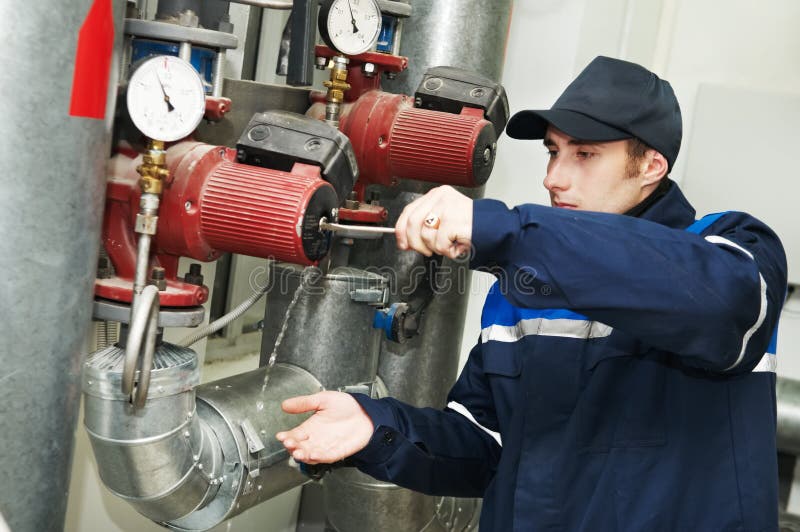 Heating engineer repairman stock photo. Image of operating - 20180090