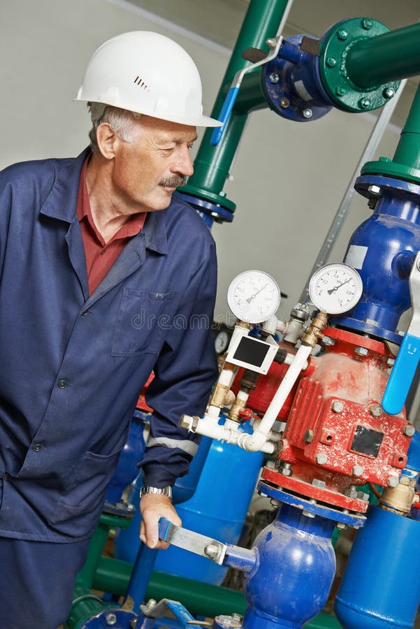 Heating Engineer Repairman in Boiler Room Stock Photo - Image of pipe ...