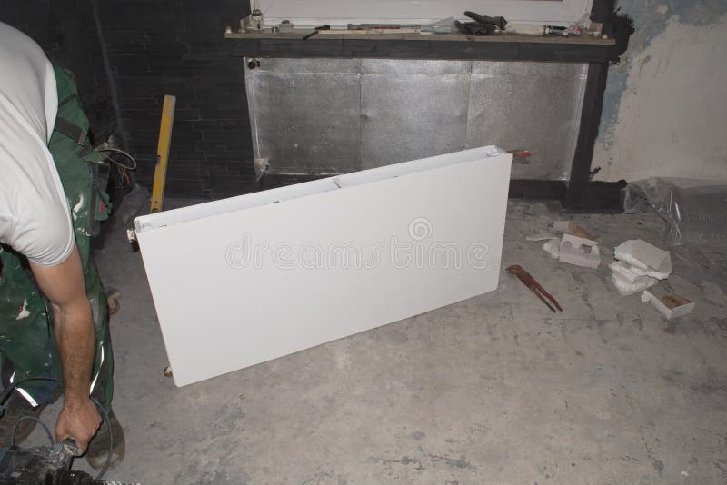 Heating installer at work stock photo. Image of heat - 241965114