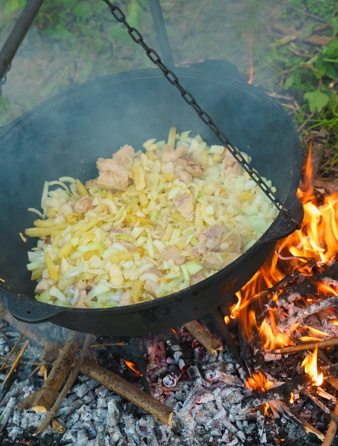 Heating Kettle with Food on Fire. Beginning Cooking Stock Photo - Image ...