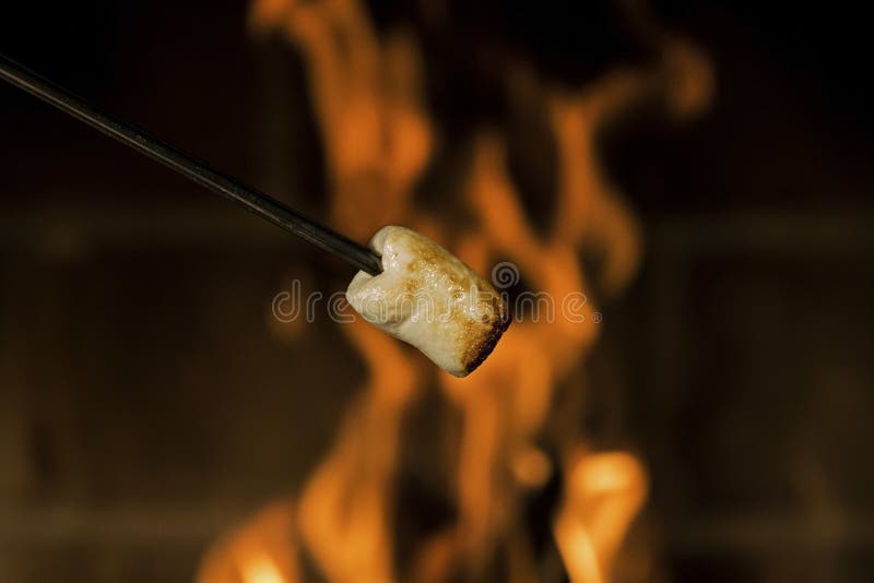 Heating Marshmallow at a Fireplace Stock Photo - Image of smoke, melted ...