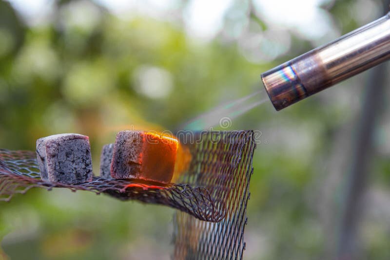 Heating with a Propane Torch for Hookah Stock Image - Image of black ...