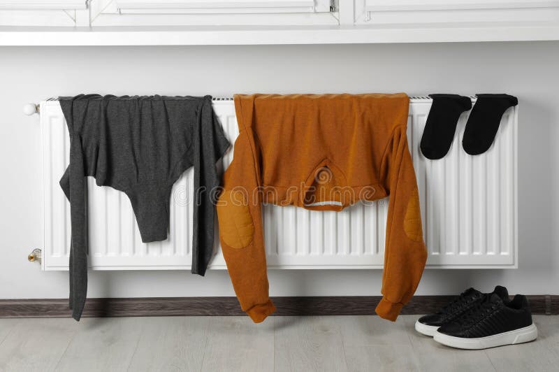 Heating Radiator with Clothes and Shoes in Room Stock Illustration ...