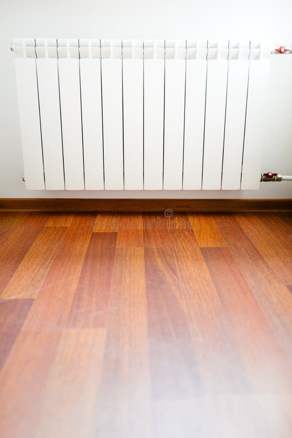 Heating radiator at home stock photo. Image of flooring - 96353610