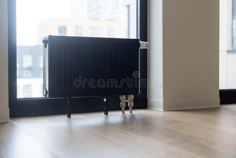 Heating Radiator in Room with Laminated Wooden Floor Stock Image ...