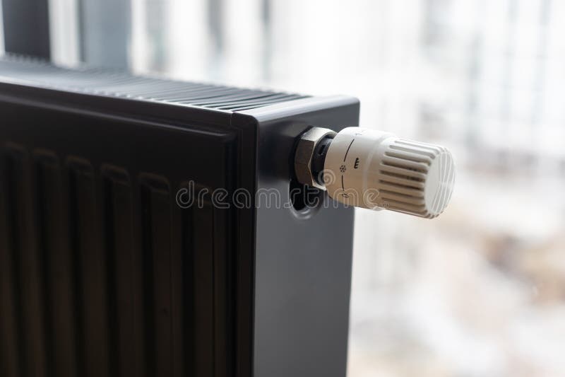 Heating Radiator in Room with Laminated Wooden Floor Stock Photo ...