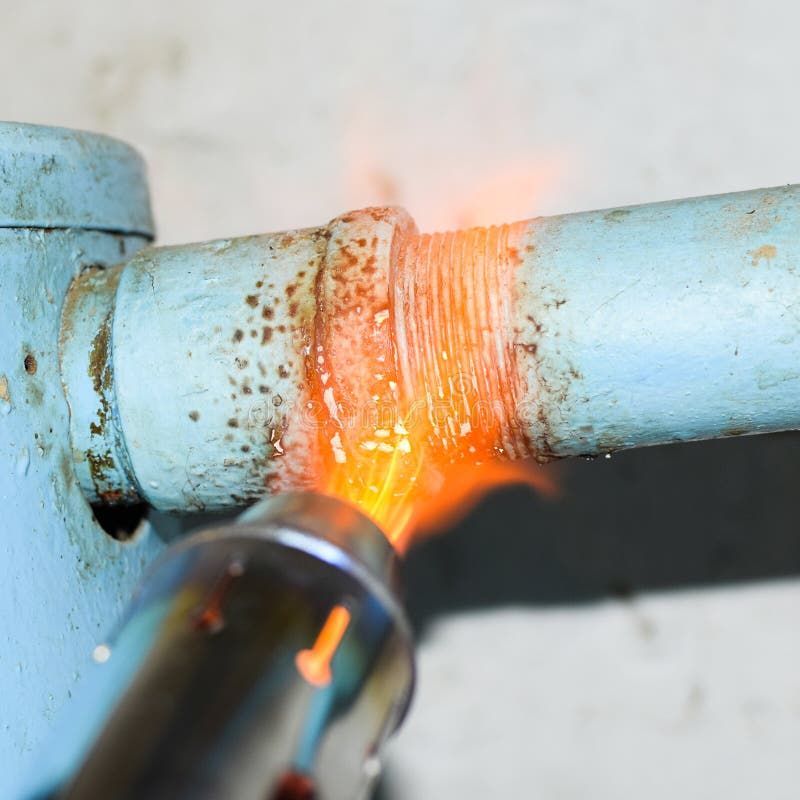 Heating a Steel Pipe with a Blowtorch. the Flame of Stock Image - Image ...