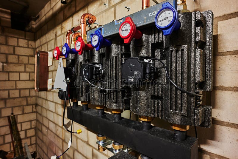 Heating System Under Construction with a View To the Thermometers of ...