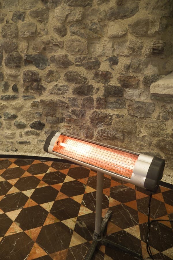 Wall-mounted Heating Device Provides Warmth in a Rustic Setting Stock ...