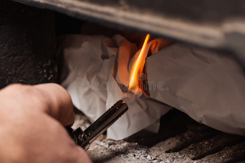 Man Holds a Gas Lighter and Makes a Fire in the Solid Fuel Boiler Stock ...