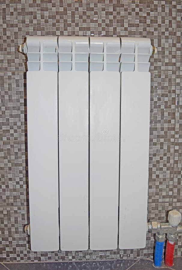 Heating White Radiator on a Background of Brown Mosaic Tiles Stock ...