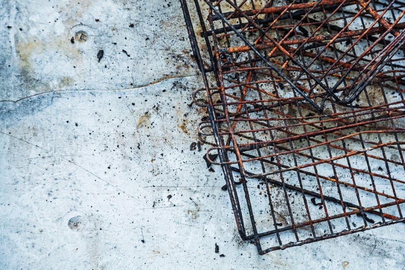 Heavily Used Rusty Barbecue Rest on a Dirty Plastic Table Stock Photo ...