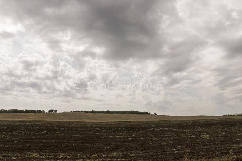 Heavy Big Grey Clouds in the Cold Autumn Sky Over Fields, Forests and ...