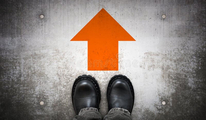 Heavy Black Leather Boots and Green Arrows on Ground Stock Image ...