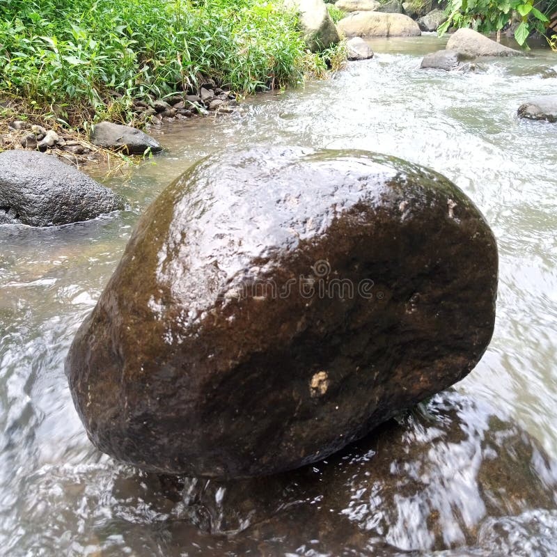 Heavy Boulder Big River Rock Stock Photo - Image of stream, shore ...