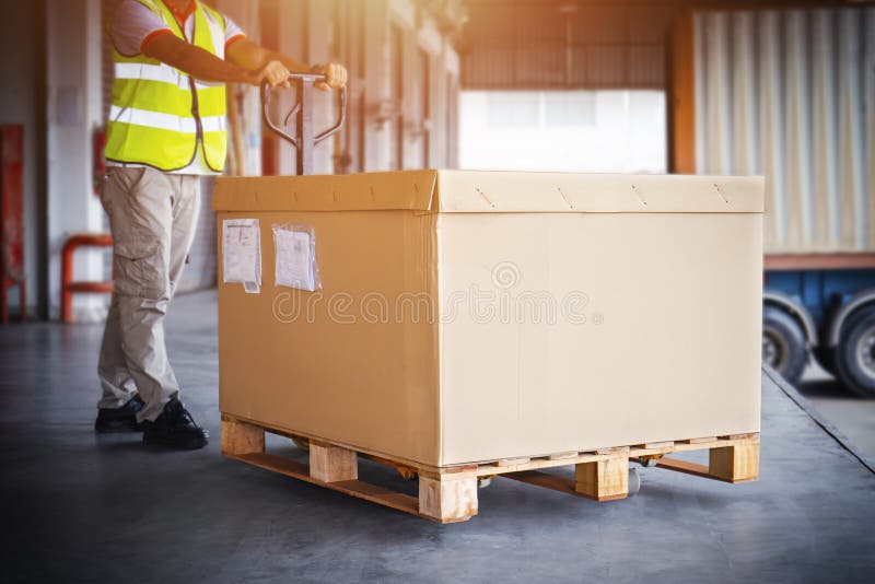 Heavy Boxes Pallet. Workers Unloading Package Boxes in Warehouse ...