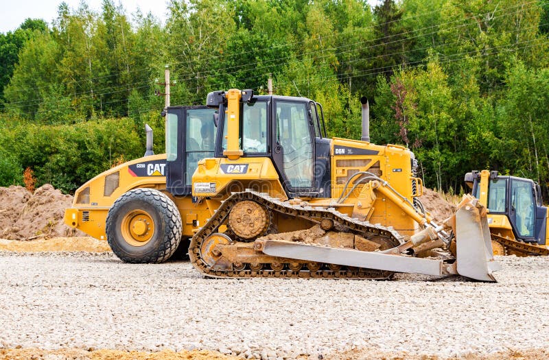 Heavy Bulldozer Loading and Moving Gravel on Road Construction ...