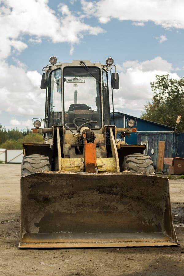 Heavy Bulldozer in the Parking Lot Stock Photo - Image of puddle ...
