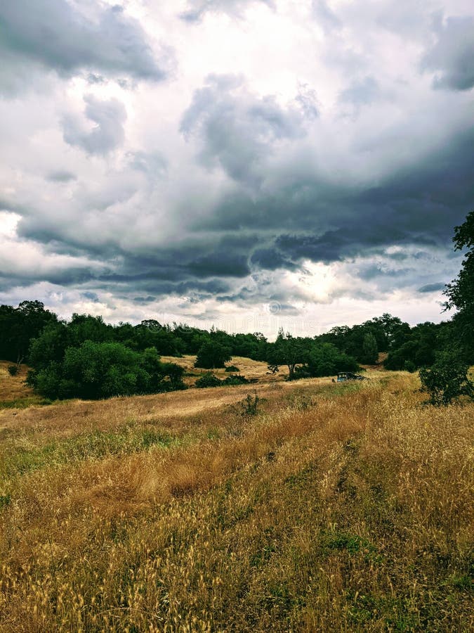 Heavy clouds over country stock image. Image of plateau - 183432551