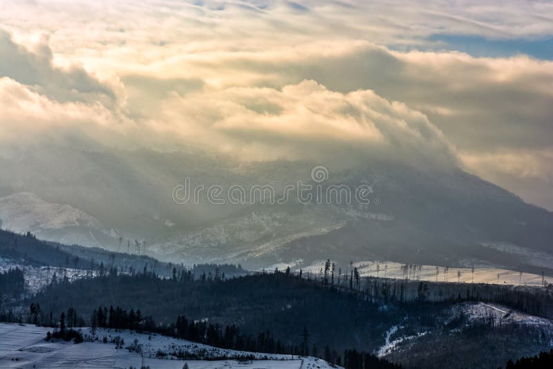 Heavy Clouds Over Mountains in Snow Stock Photo - Image of heavy ...