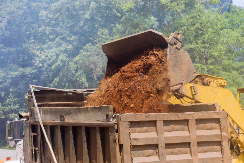 Heavy Construction Equipment Load Earth into Dump Truck Using ...