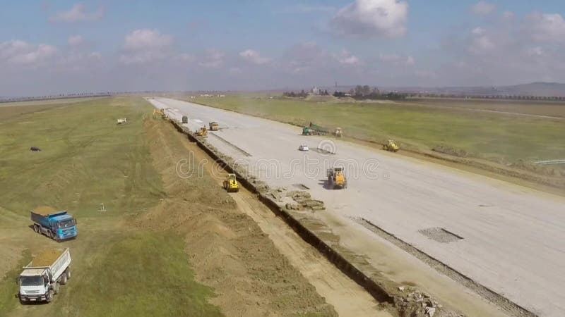 Heavy Construction Equipment Working on an Airport Runway Stock Video ...