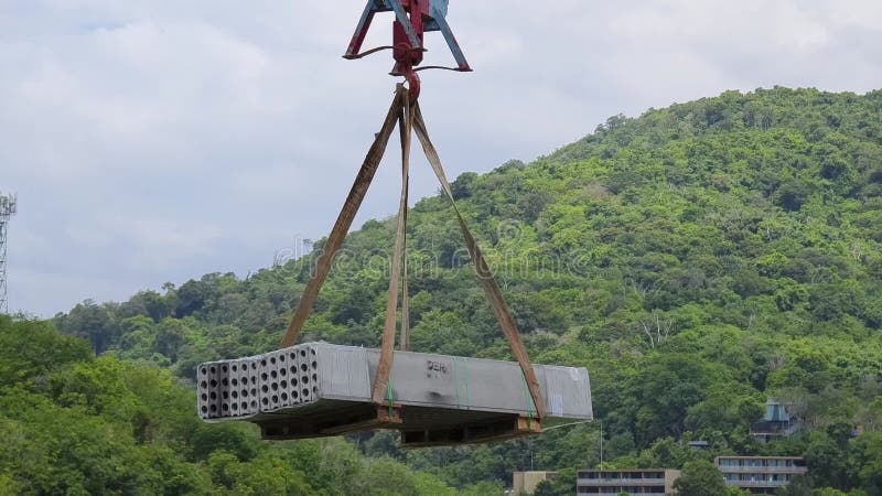 Heavy Construction Load Being Lifted by a Tall Crane Stock Footage ...
