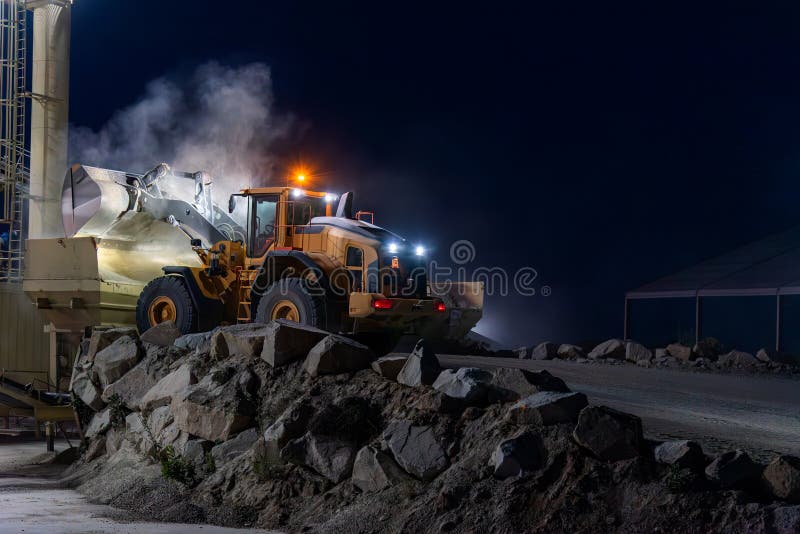 Heavy Construction and Mining Machinery Unloading Gravel into Silos on ...