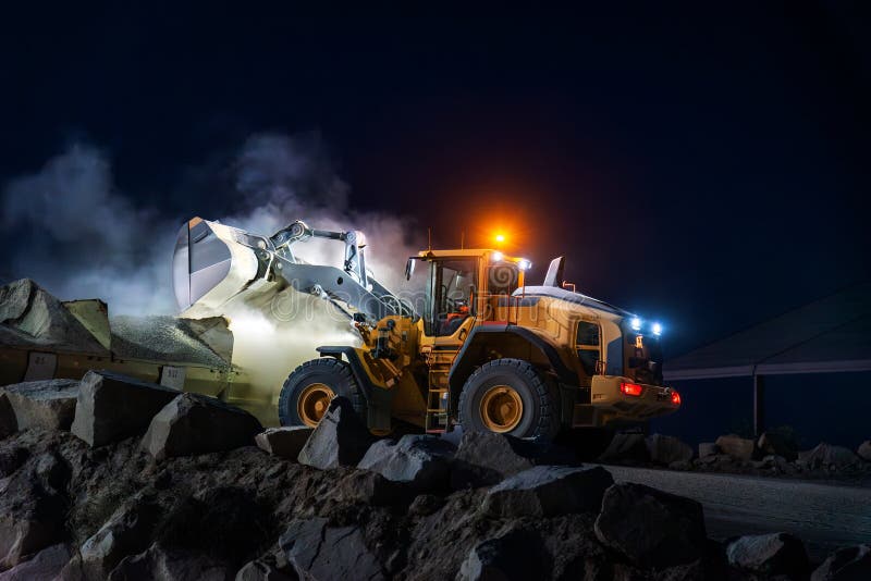 Heavy Construction and Mining Machinery Unloading Gravel into Silos on ...