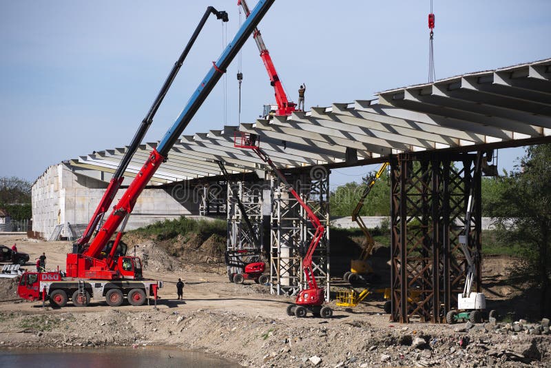 Heavy Cranes Lifting Bridge Segments during Large-scale Construction ...