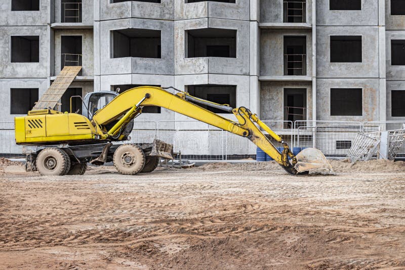 A Heavy Crawler Excavator with a Large Bucket is Getting Ready for Work ...