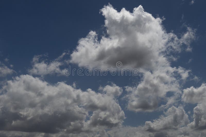 Heavy Cumulus Clouds Gathering in a Deep Blue Sky Stock Photo - Image ...