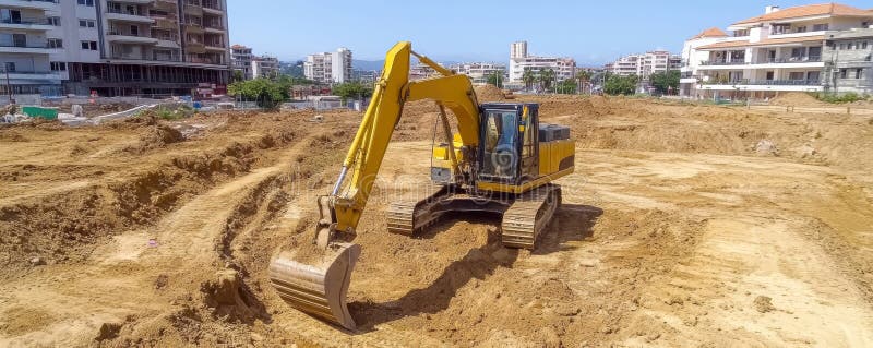 Heavy Duty Excavator Working Relentlessly To Move Earth and Shape the Future at a Busy ...