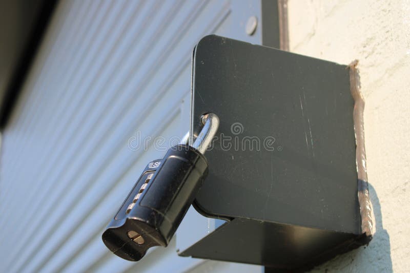 Heavy Duty Number Combination Padlock Attached To a Locked Shutter ...