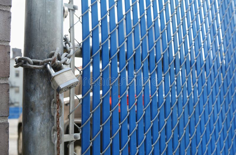 Heavy-duty Padlock and Chain on Blue Security Gate Stock Image - Image ...