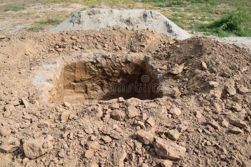 Heavy Earthmoving Work - Deep Freshly Dug Pit with Exposed Soil and ...