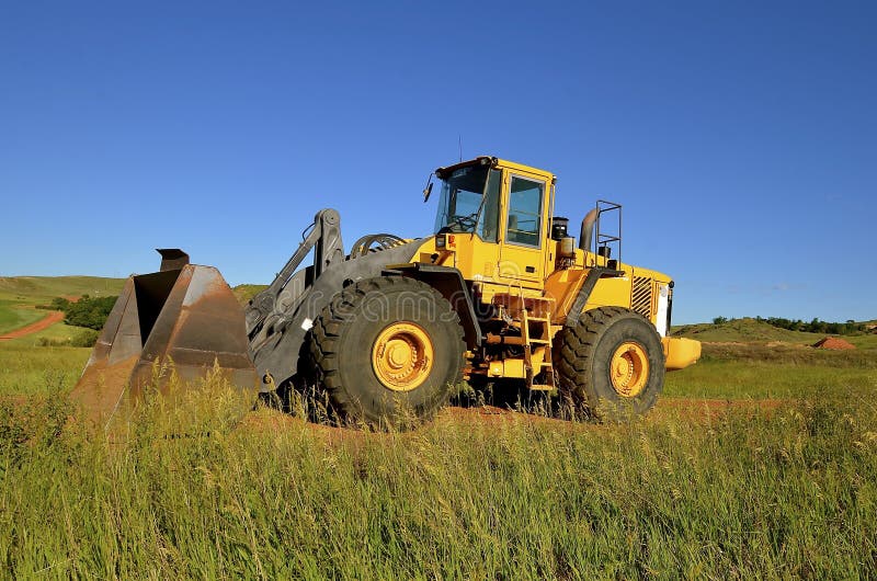 Front end loaders at work stock photo. Image of scoop - 4395144