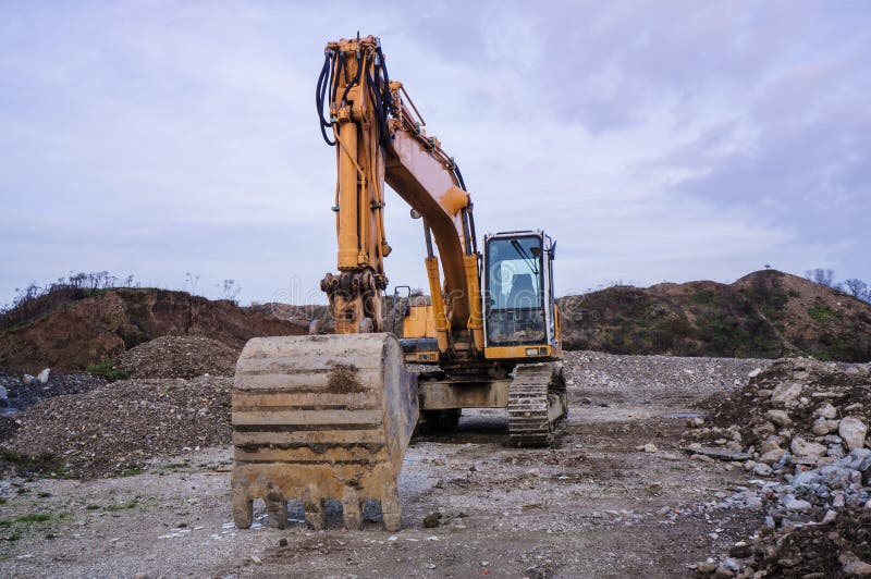 Grader and Excavator Construction Equipment Yard Stock Image - Image of ...