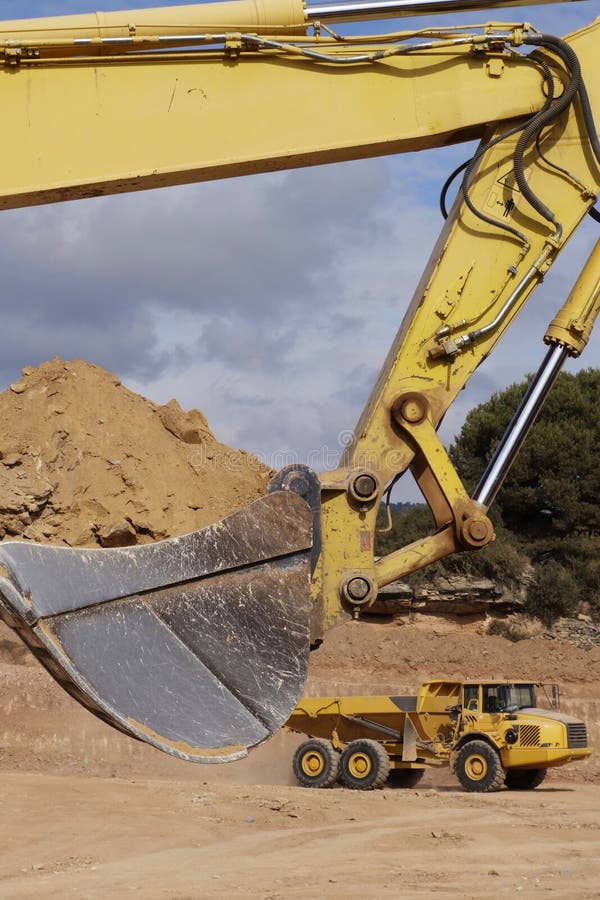 Heavy excavator and truck stock image. Image of working - 61572975