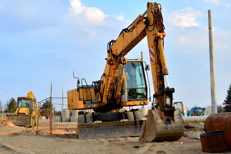 A Heavy Excavator in Working at Construction Site. Special Heavy ...