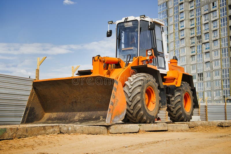 Heavy Front Loader or Bulldozer at the Construction Site. Construction ...