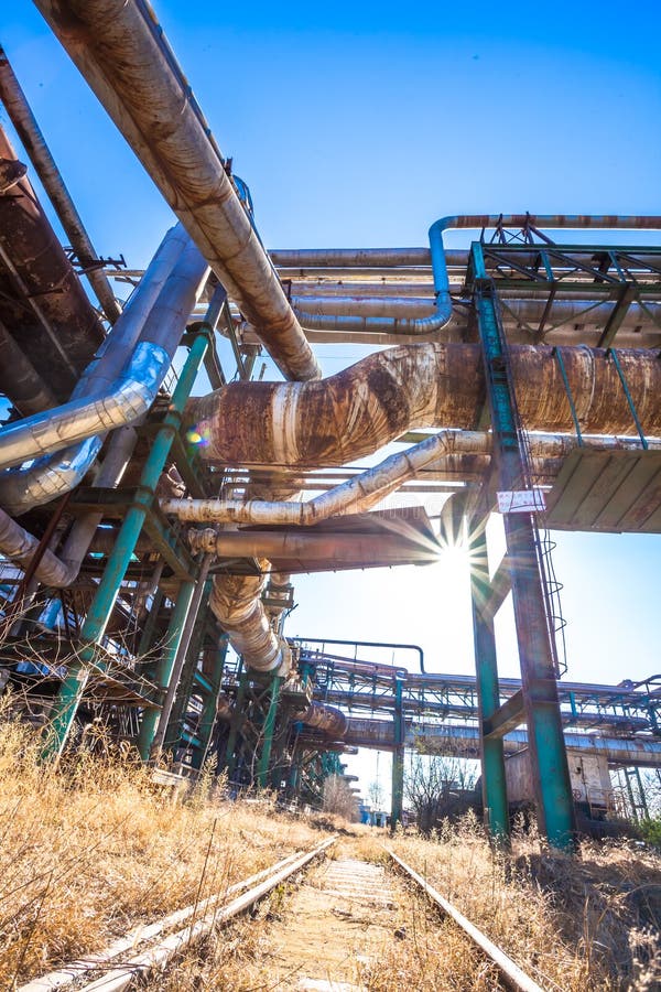 A factory with pipelines stock photo. Image of barrel - 128256840 A factory with pipelines stock photo. Image of barrel - 128256840