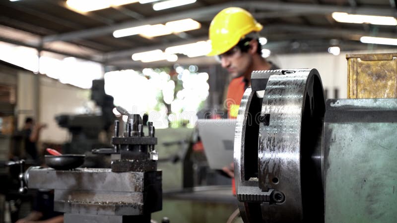 Heavy Industry Worker Man with Laptop Computer is Checking and ...