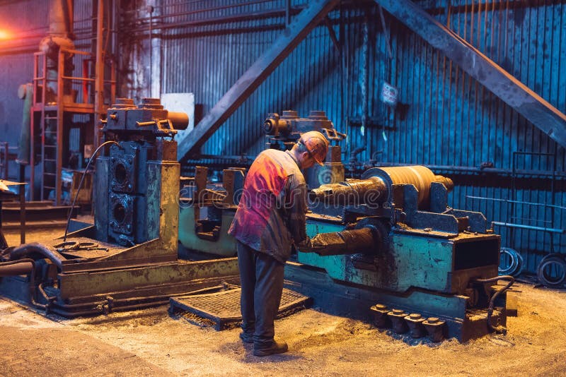 Heavy Industry Worker Working Machine. Rough Industrial Environment ...